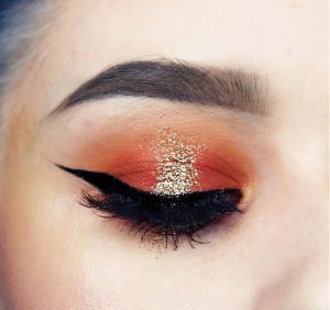 Embrace Edgy Red Eye Makeup This Holiday Season | BEAUTY